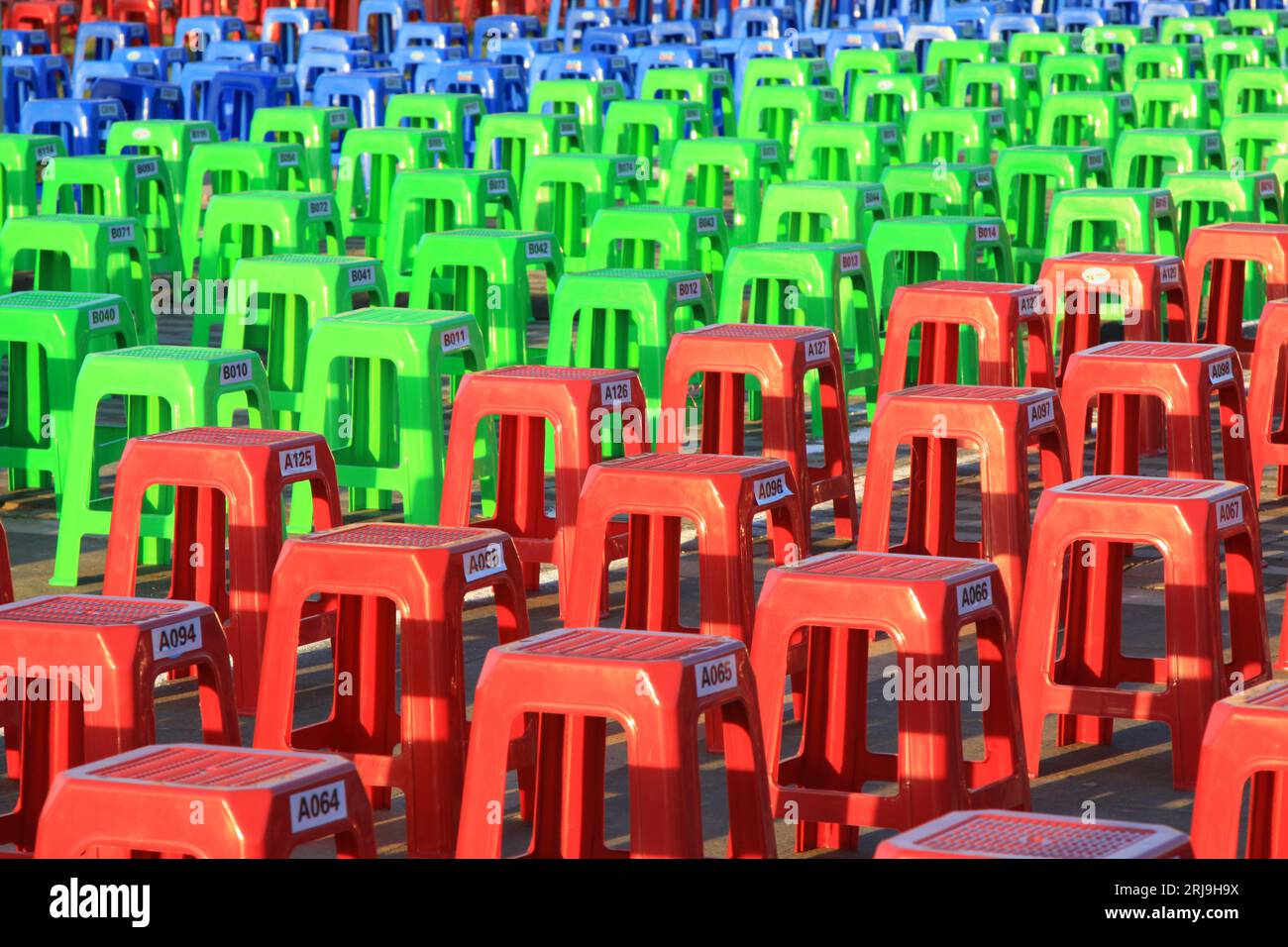 Plastic stools in the square in a park, north china Stock Photo - Alamy