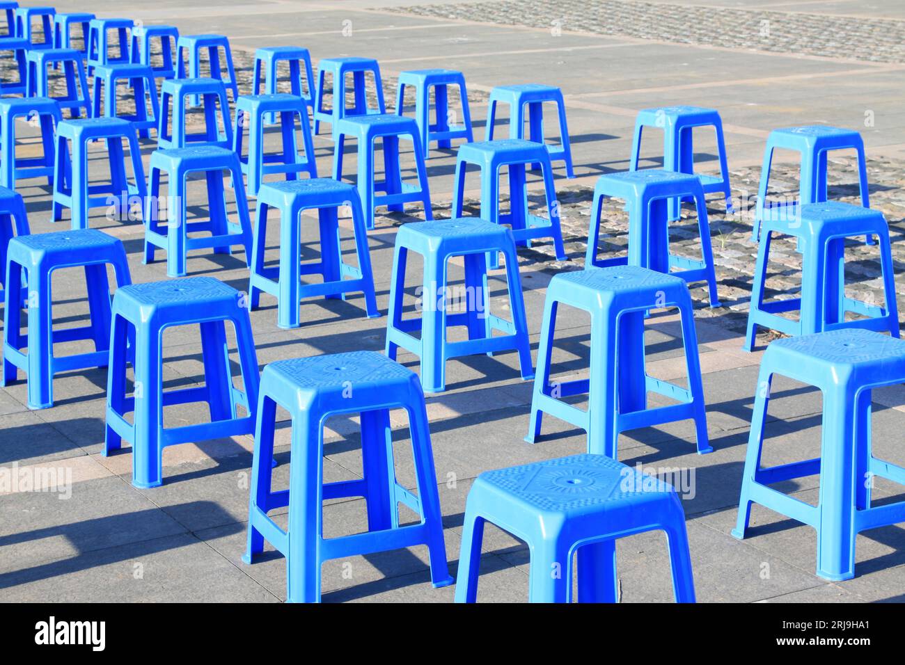 Plastic stools in the square in a park, north china Stock Photo - Alamy