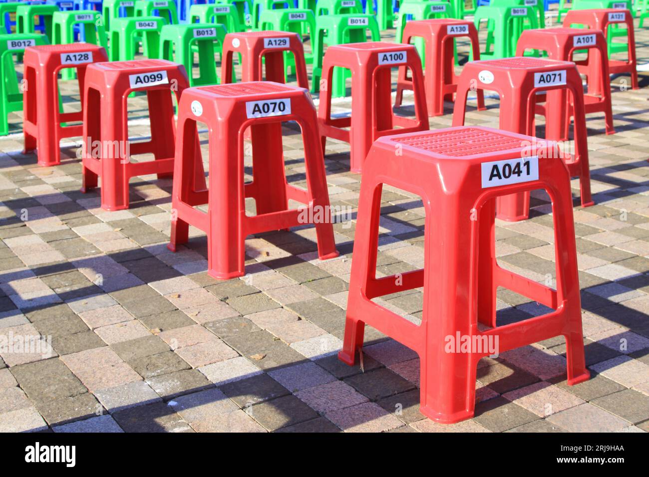 Plastic stools in the square in a park, north china Stock Photo - Alamy
