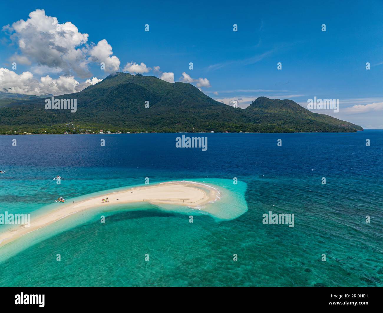 Transaparent sea water and waves in white sand beach and boats in ...
