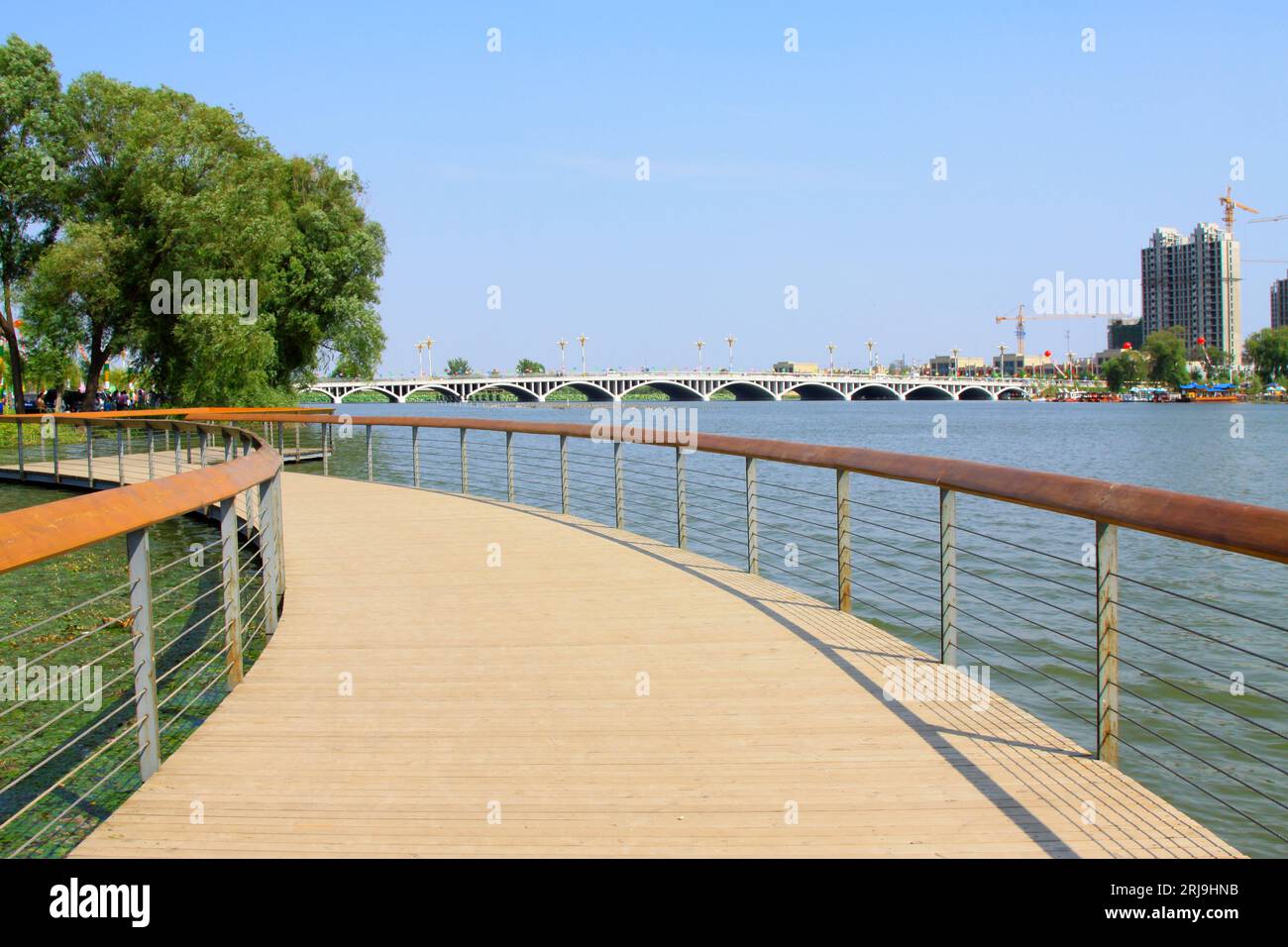 Curved bridge landscape in a park, china Stock Photo - Alamy