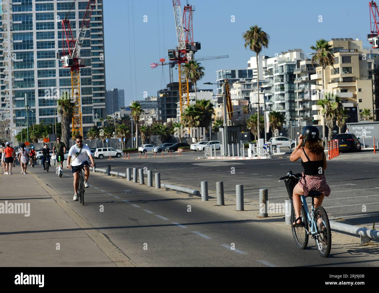 cyclers cycling along the waterfront promenade in Tel-Aviv, Israel ...