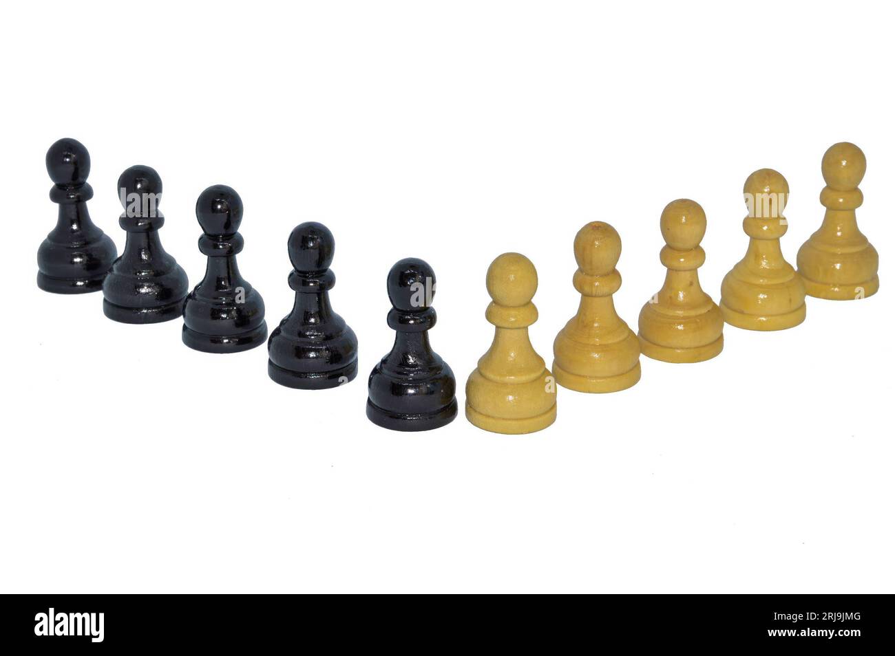 Two wooden varnished pawns black and white against each other ...