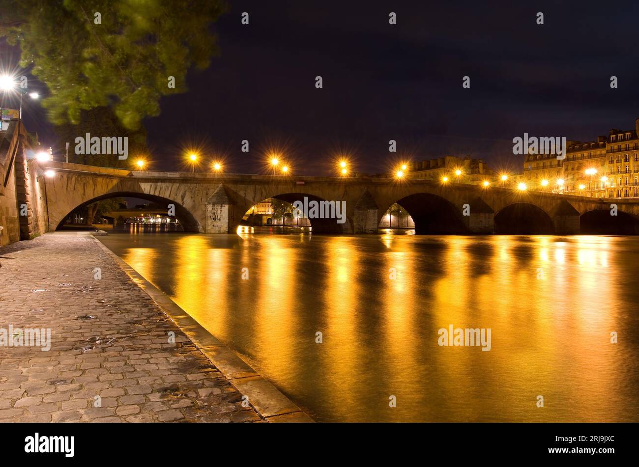 River Seine and Pont Royal bridge at night, Paris, France Stock Photo ...