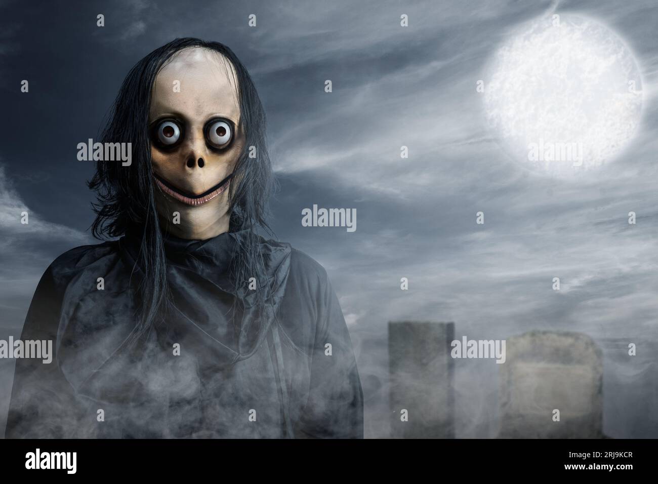 Scary Momo standing in the graveyard with a night scene background ...