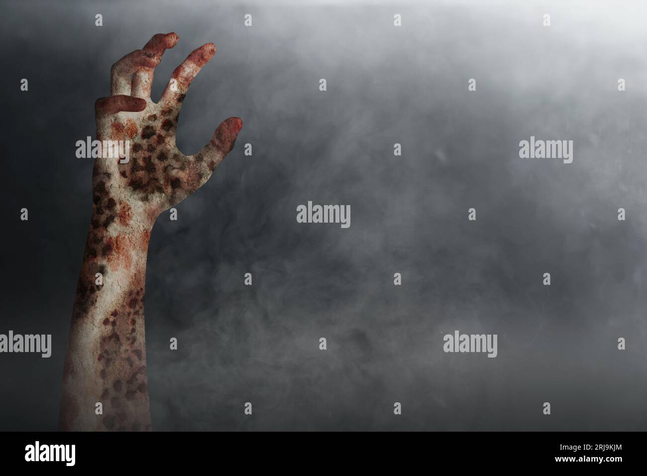 Zombie's hand with a dark background. Scary Halloween concept Stock ...