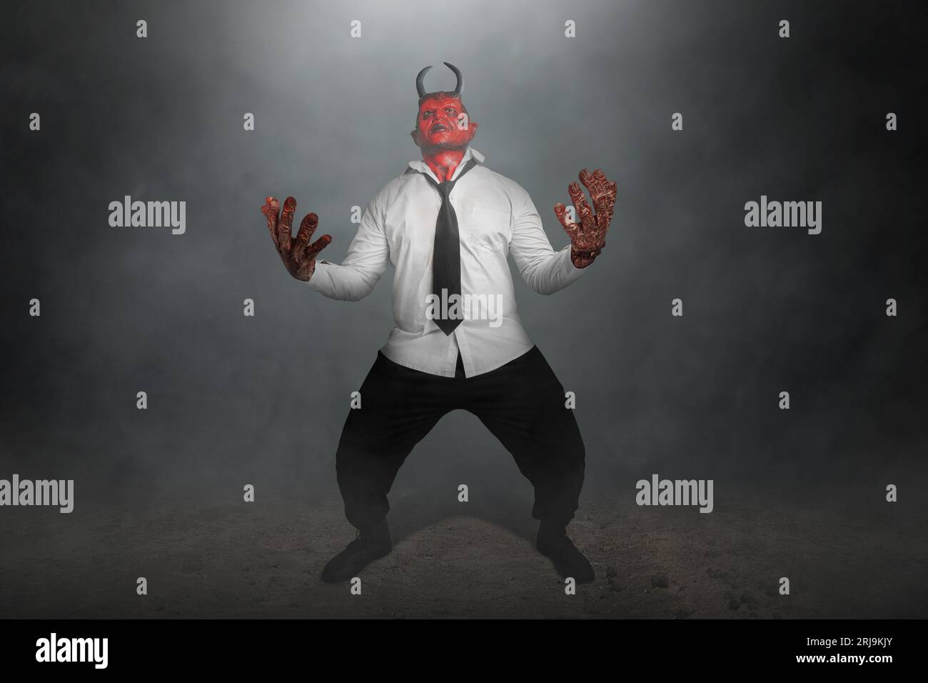 Devilman is standing in the dark background. Scary demon Halloween ...