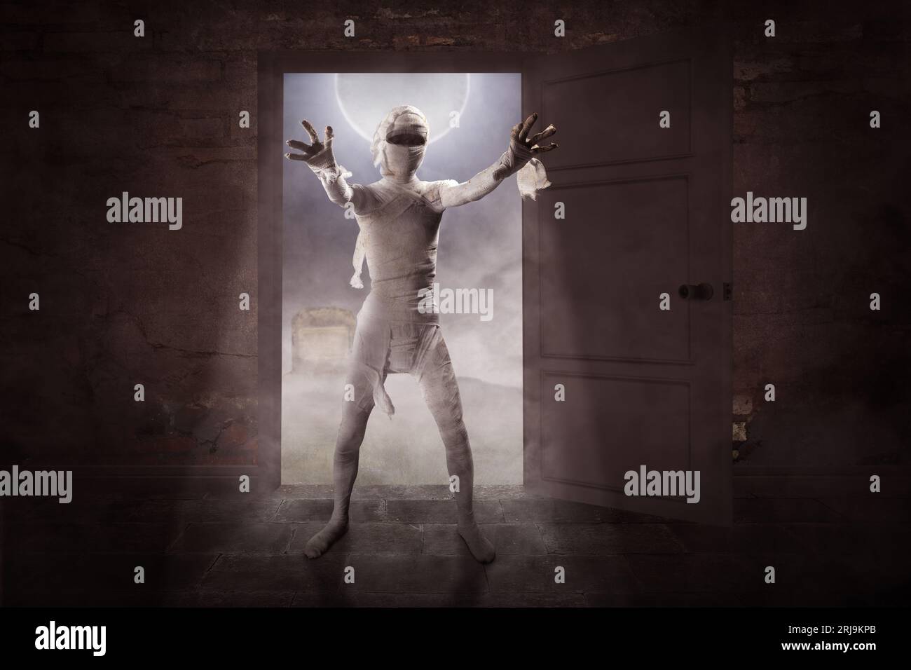 Mummy standing with the graveyard and a night scene background. Scary ...