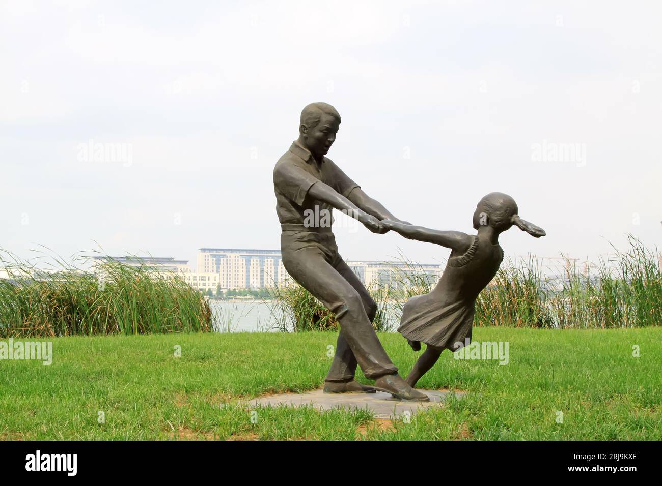 Dance sculpture in the park, green grass, beautiful environment Stock ...