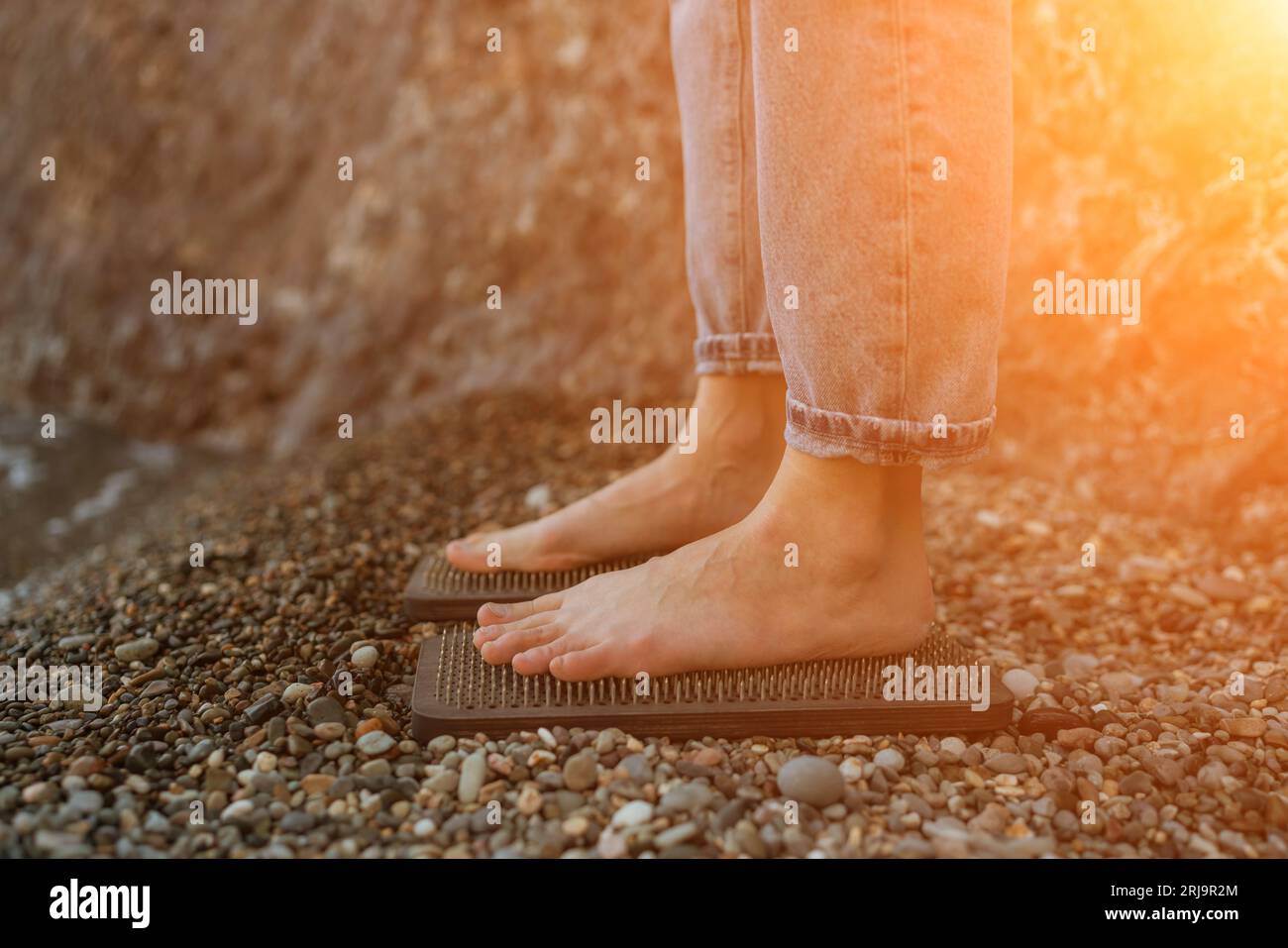 Sea Woman feet stepping on sadhu board during indian practice on the ...
