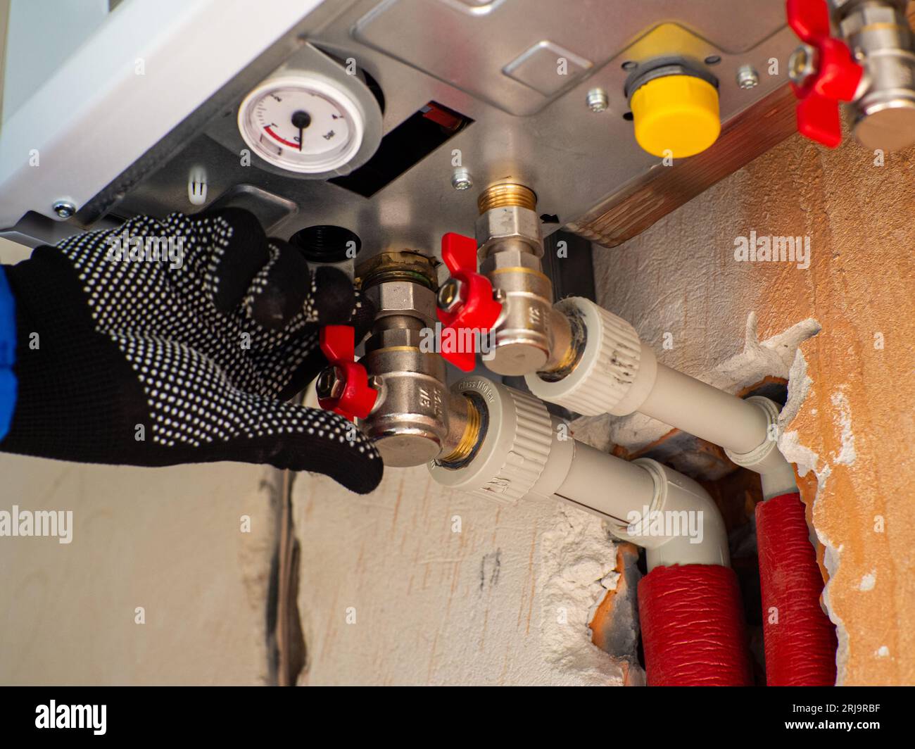 Installing heating and water pipes in apartment Stock Photo - Alamy