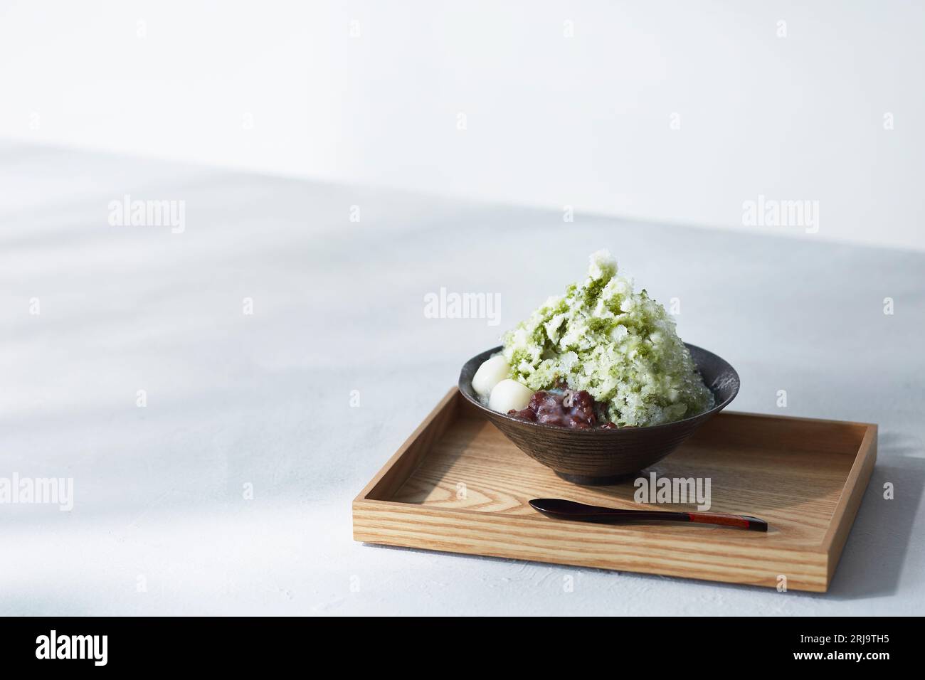 Shaved ice with shiratama, azuki beans and green tea on a tray Stock ...