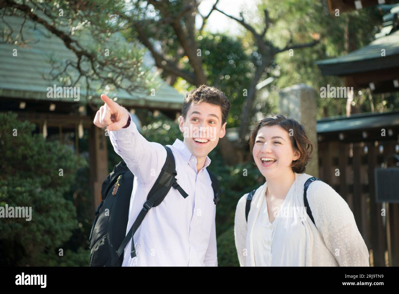 Smiling foreign tourists at the shrine Stock Photo - Alamy