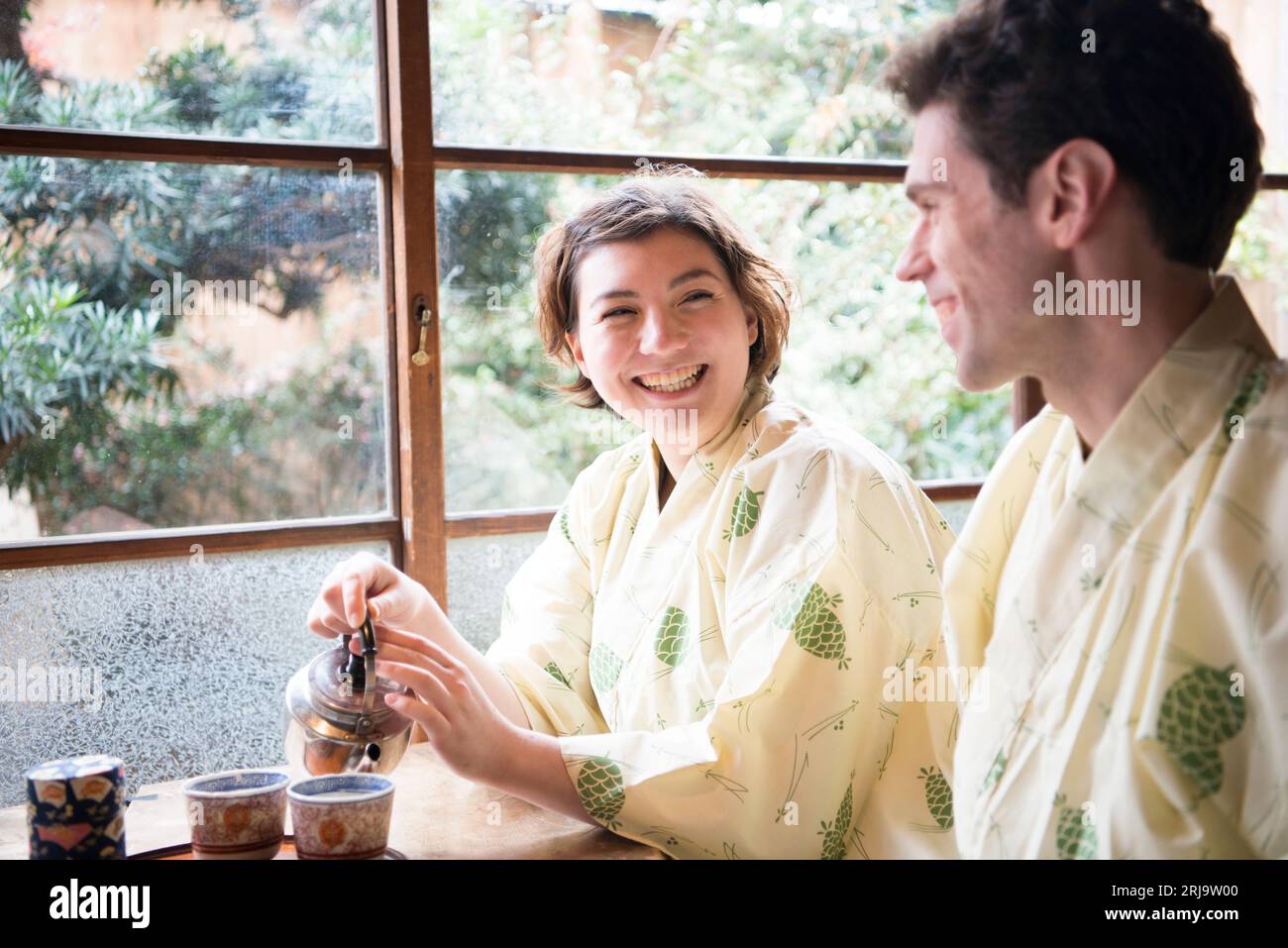 Foreign couple making tea in yukata Stock Photo - Alamy