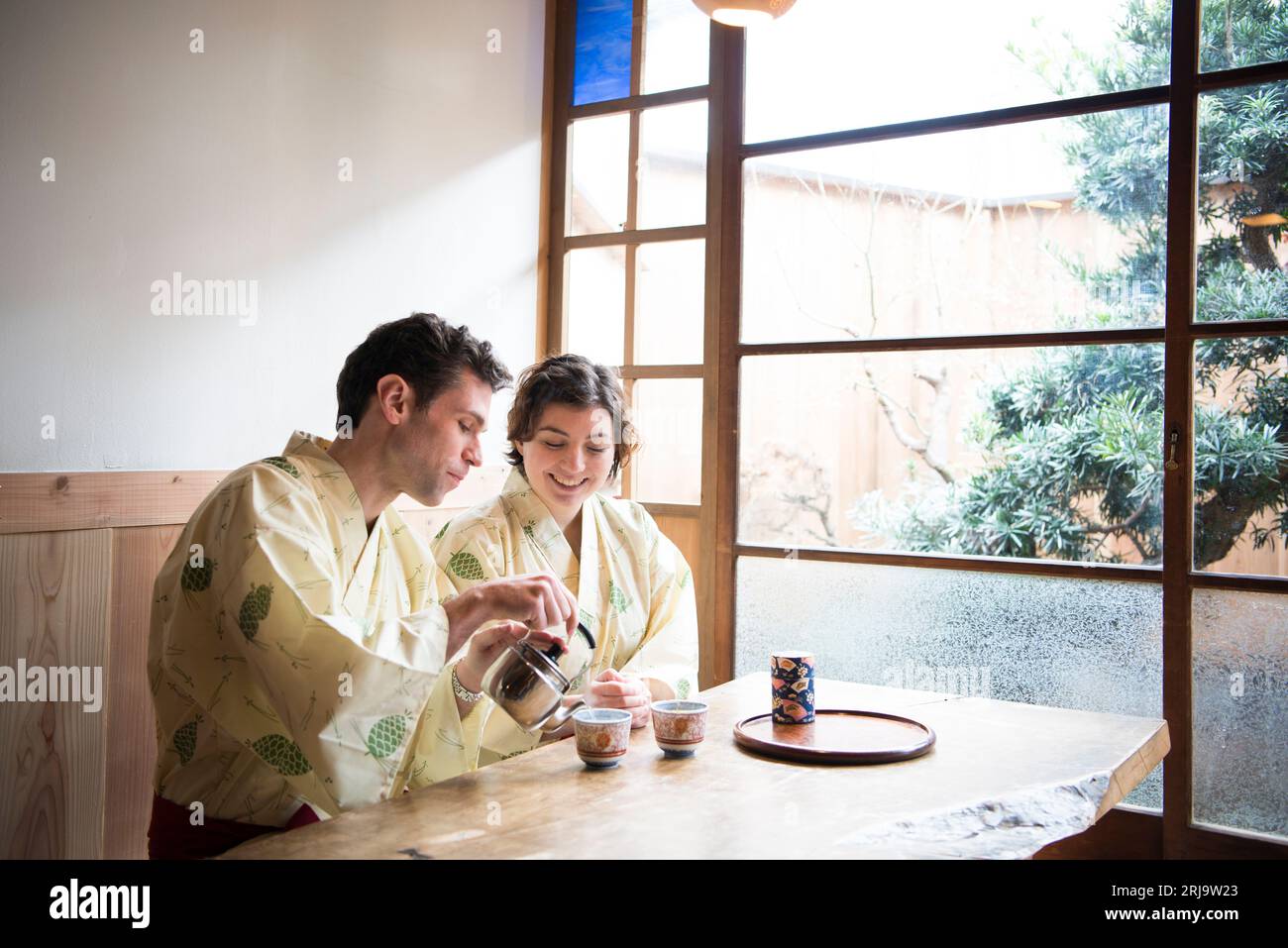 Foreign couple making tea in yukata Stock Photo - Alamy