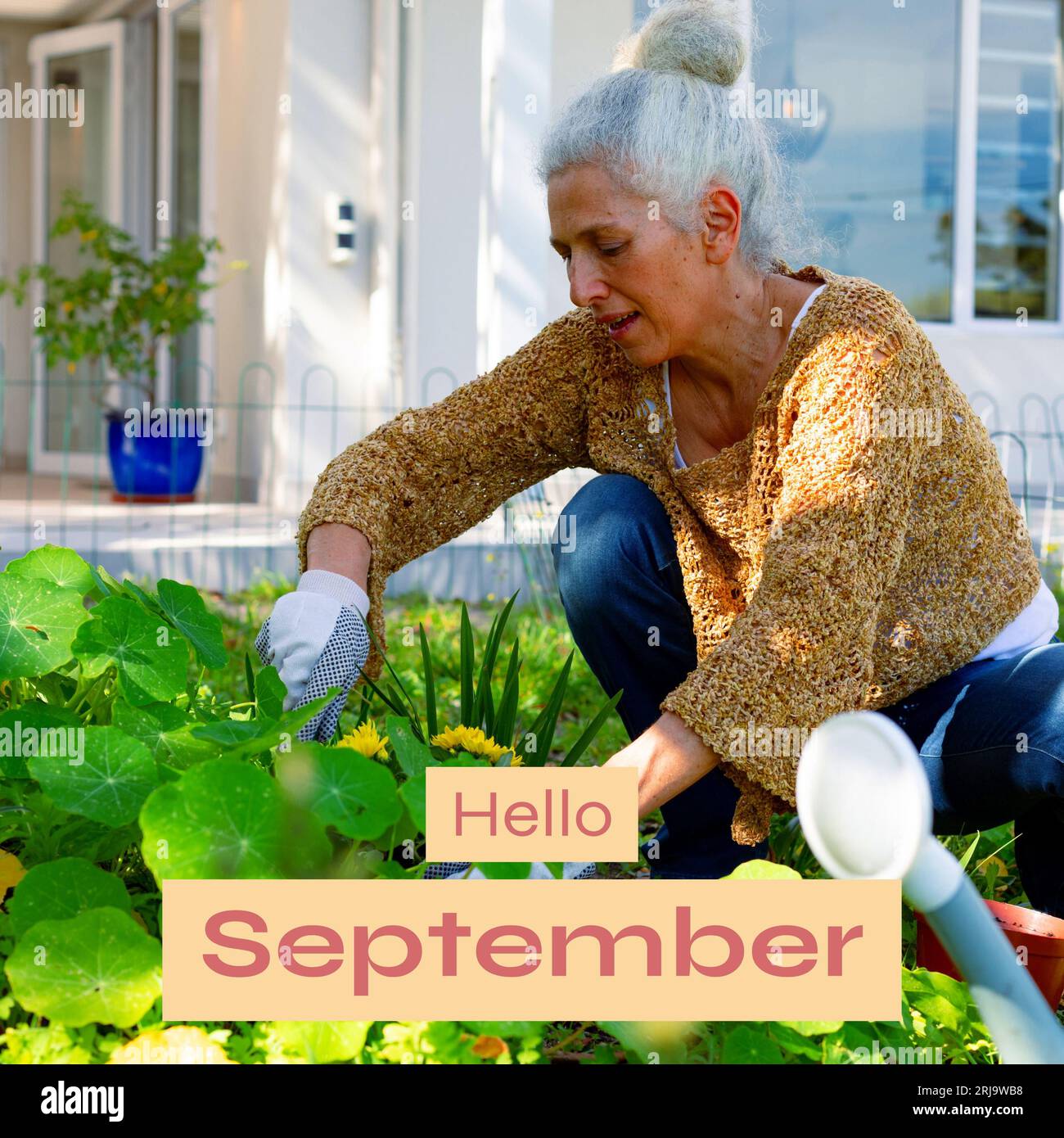 Composite of hello september text over caucasian woman in garden Stock ...