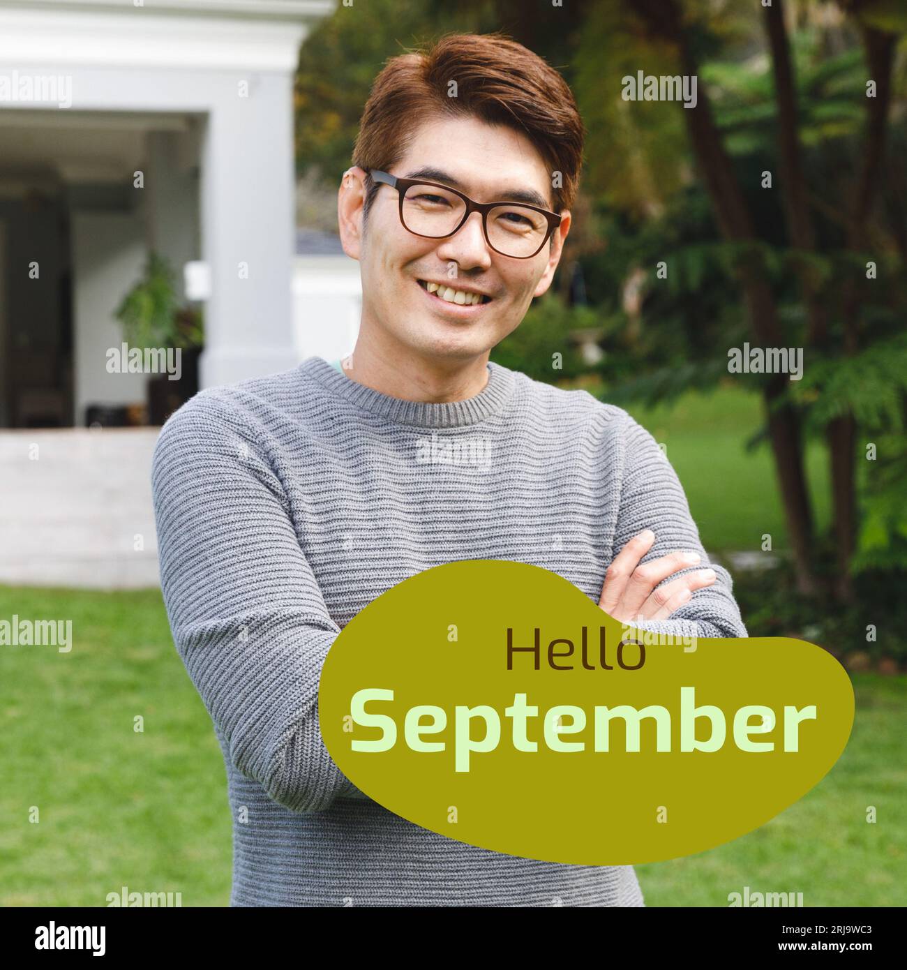 Composite of hello september text over smiling asian man in garden ...