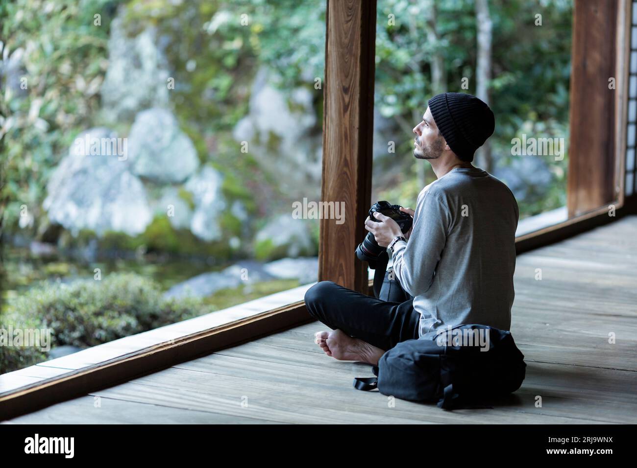 Foreign men and women sitting on the veranda Stock Photo - Alamy