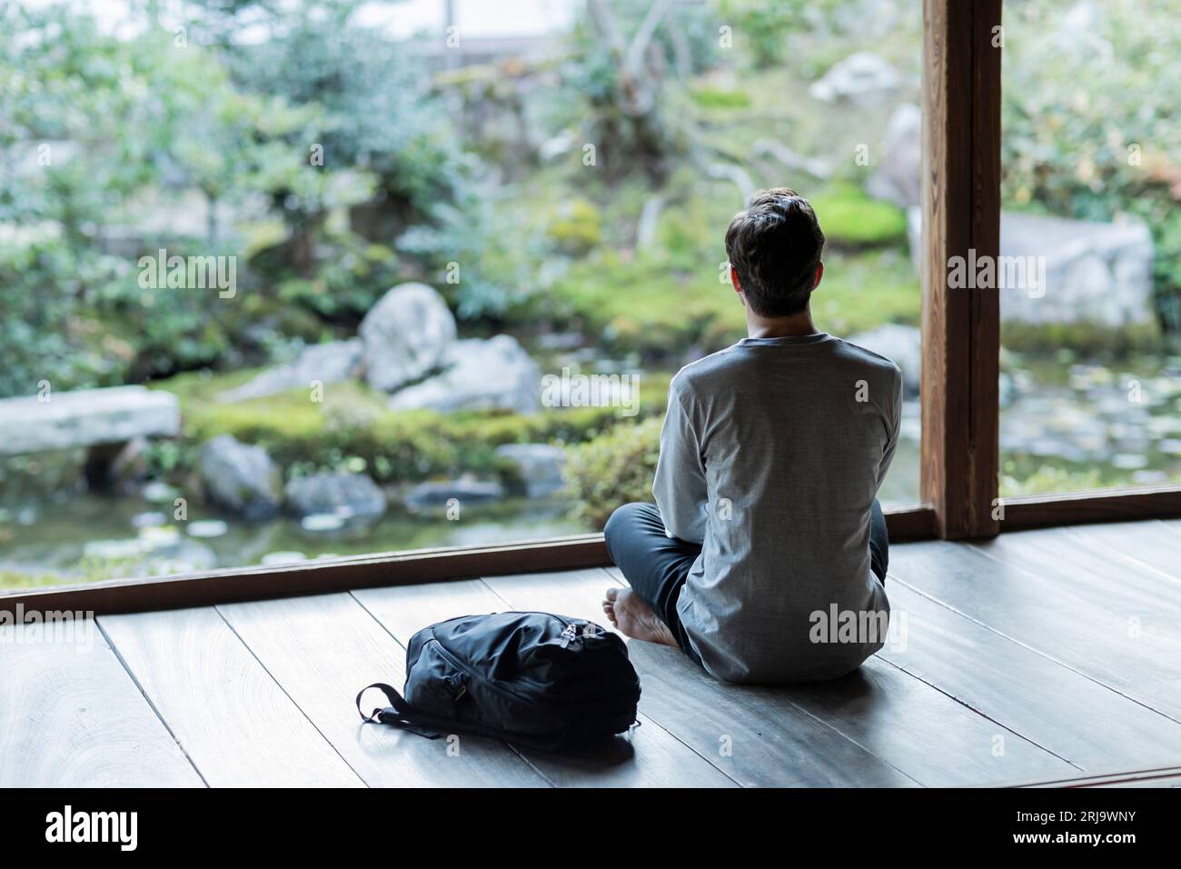 Foreign men and women sitting on the veranda Stock Photo - Alamy