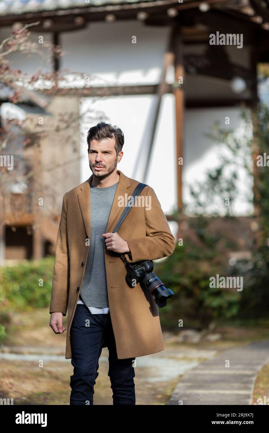 Foreign men and women touring a temple Stock Photo - Alamy