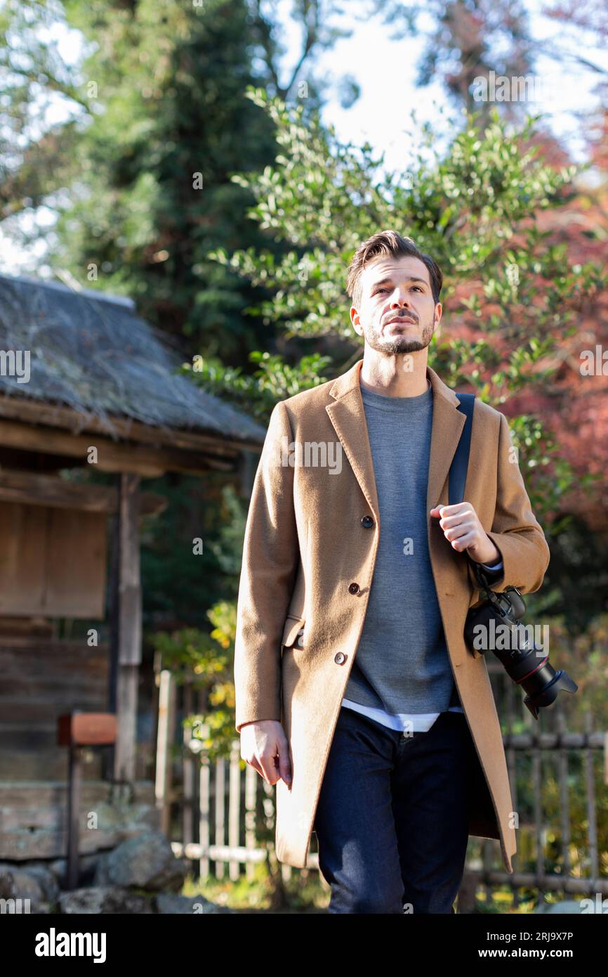 Foreign men and women touring a temple Stock Photo - Alamy