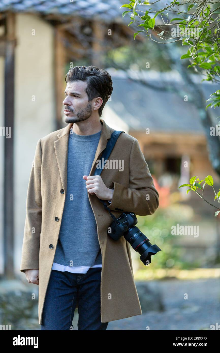 Foreign men and women touring a temple Stock Photo - Alamy