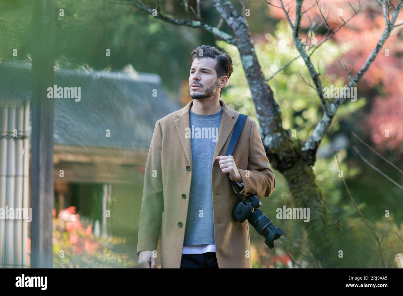 Foreign men and women touring a temple Stock Photo - Alamy