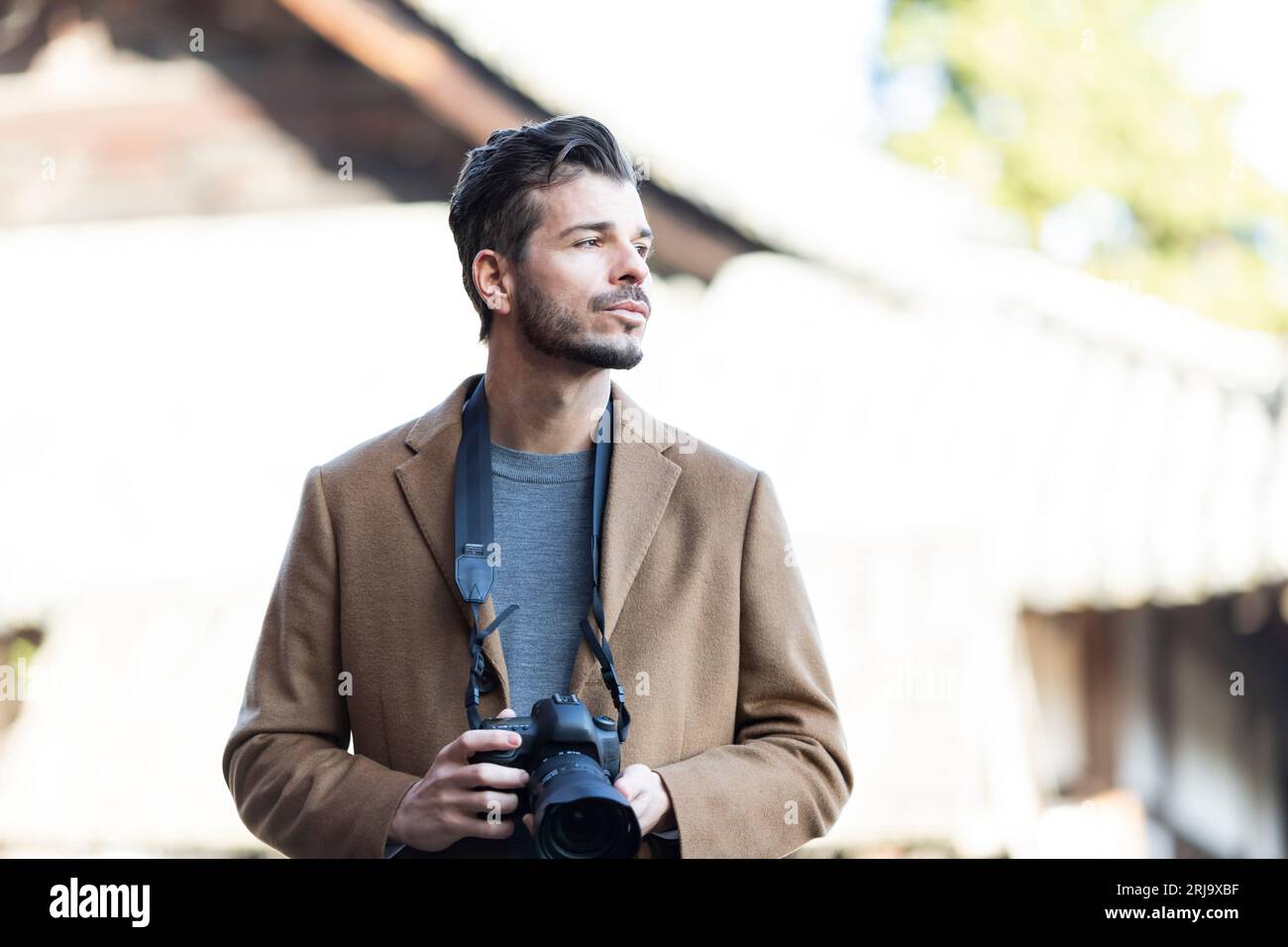 Foreign man taking a picture with a camera Stock Photo - Alamy
