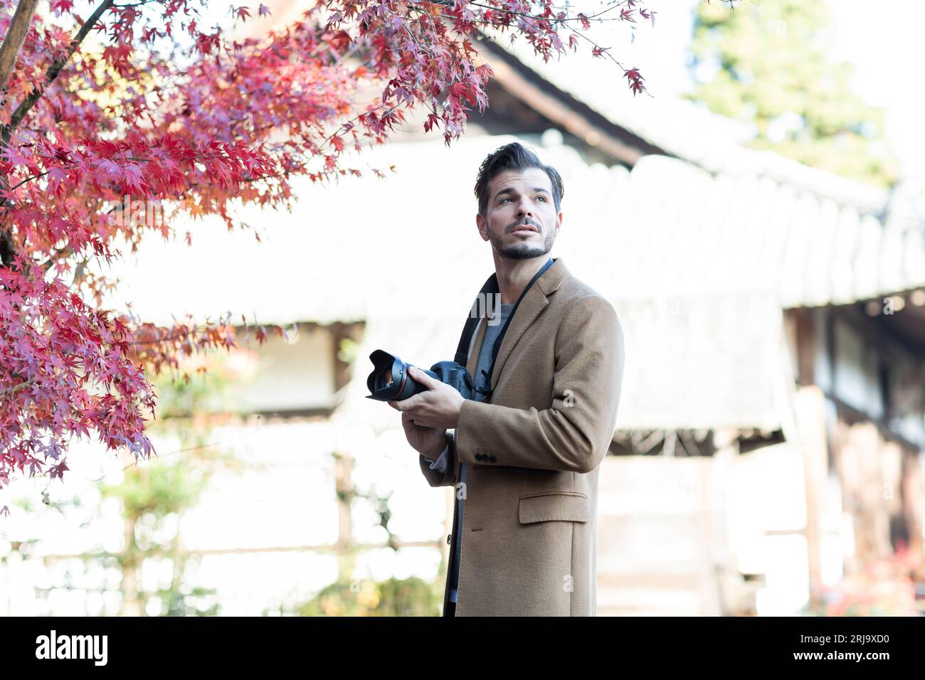Foreign man taking a picture with a camera Stock Photo - Alamy