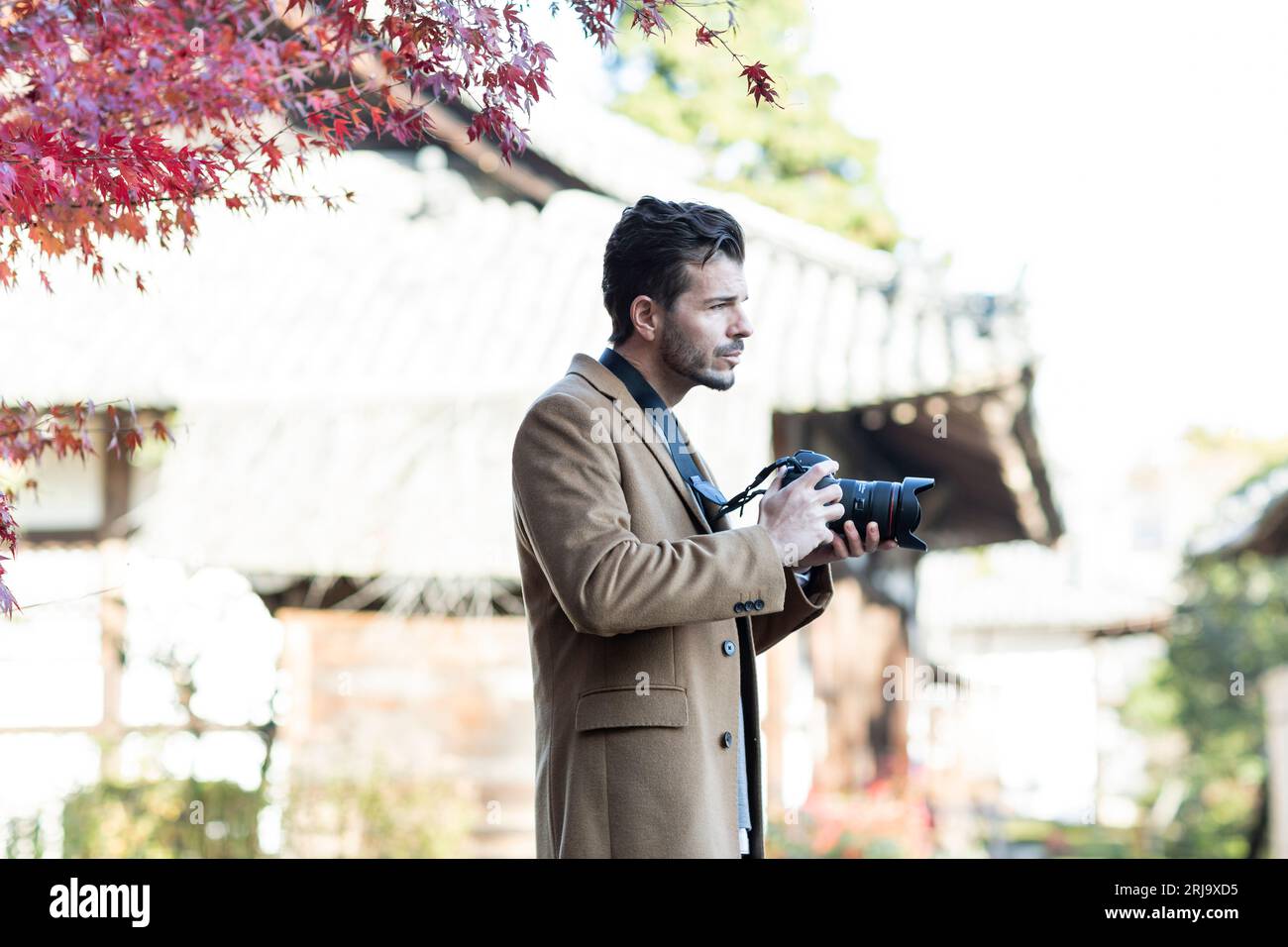 Foreign man taking a picture with a camera Stock Photo - Alamy