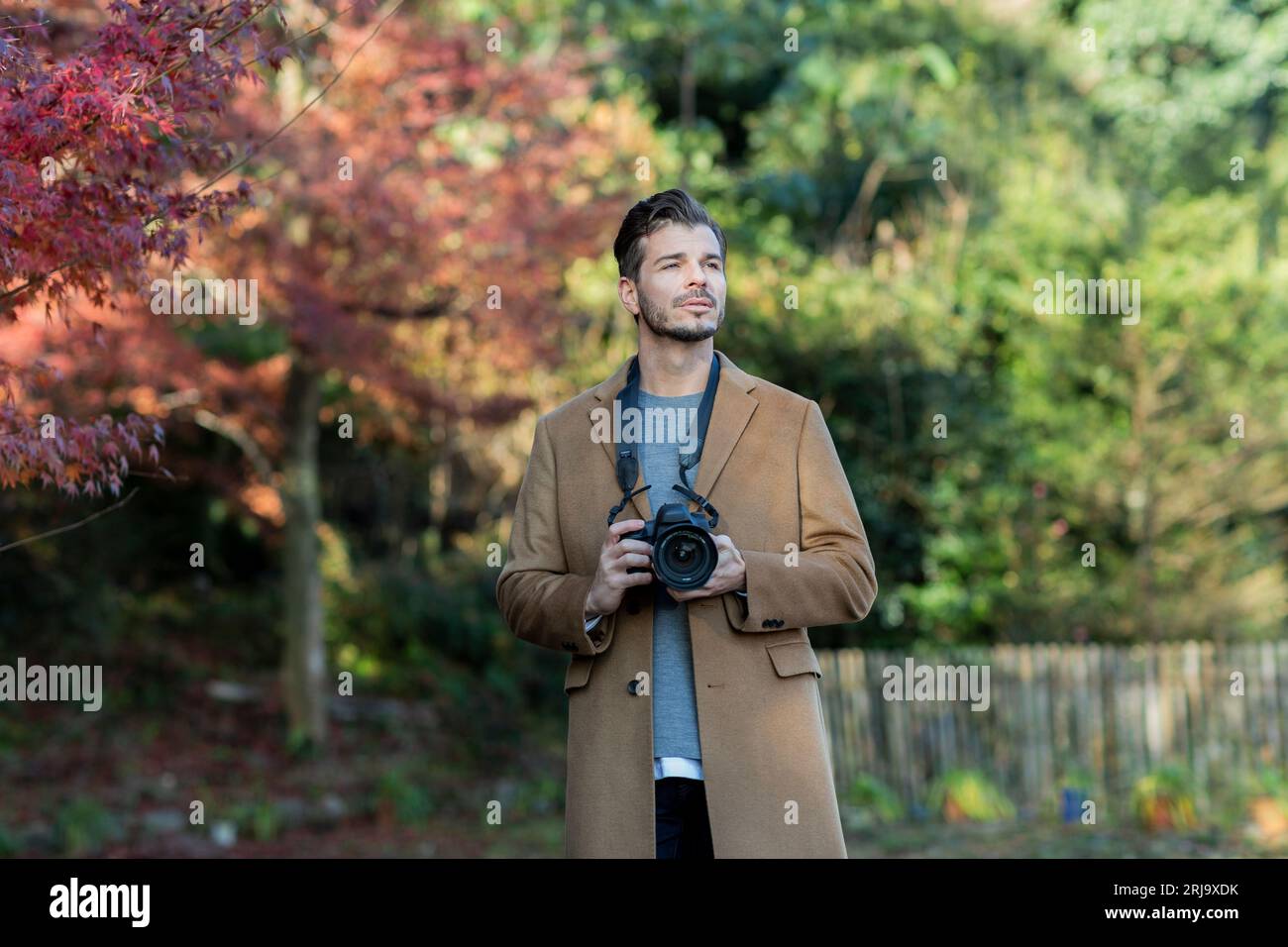 Foreign man taking a picture with a camera Stock Photo - Alamy
