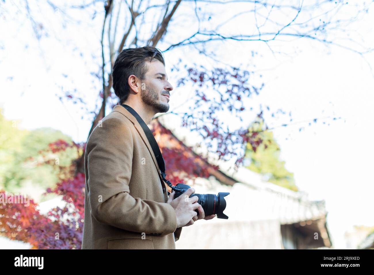 Foreign man taking a picture with a camera Stock Photo - Alamy