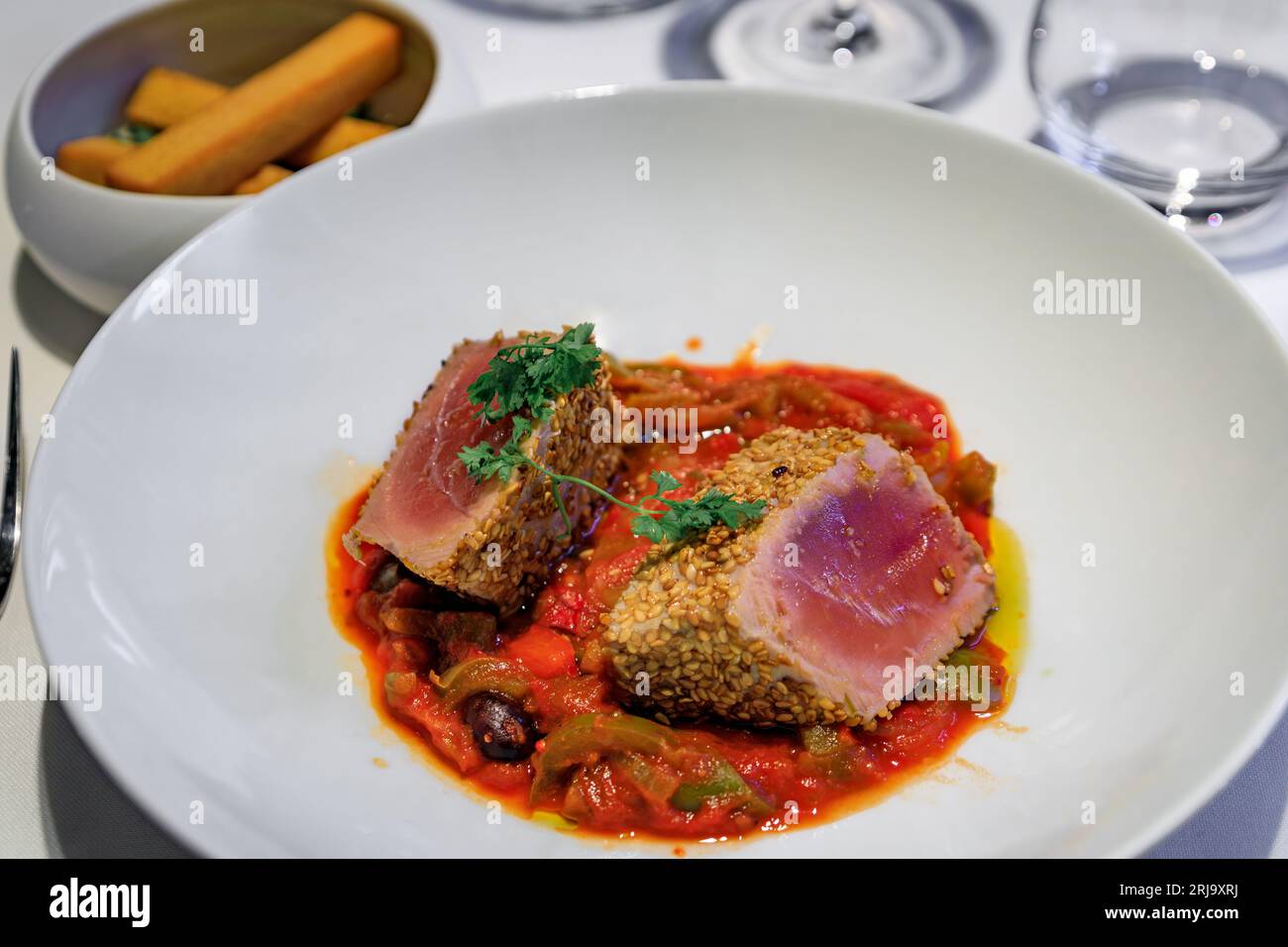 Sesame crusted rare seared tuna over piperade pepper sauce with panisse ...