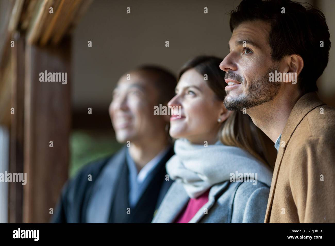Foreign men and women touring a temple Stock Photo - Alamy