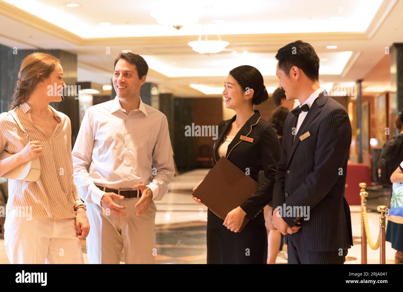 Four foreign men women hi-res stock photography and images - Alamy