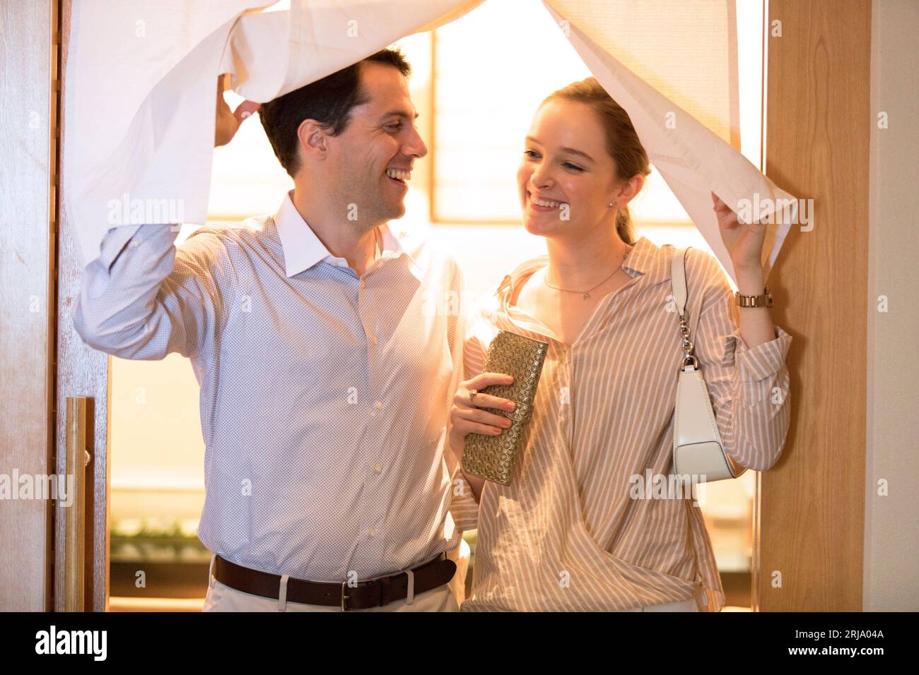Foreign man and woman leaving the restaurant Stock Photo - Alamy