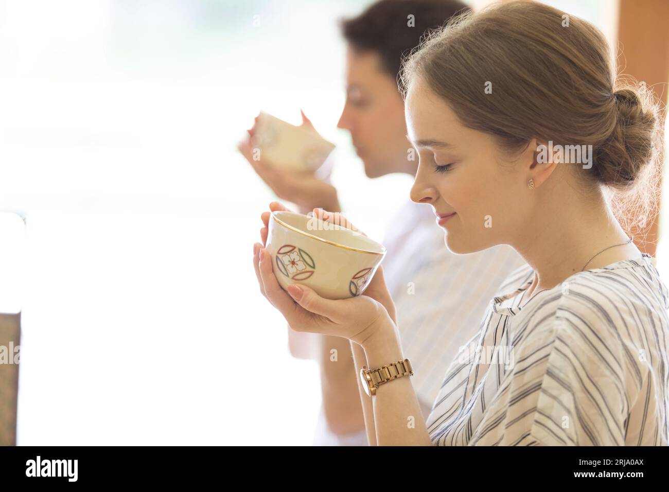 Foreign tourists, male and female, enjoying matcha tea Stock Photo - Alamy