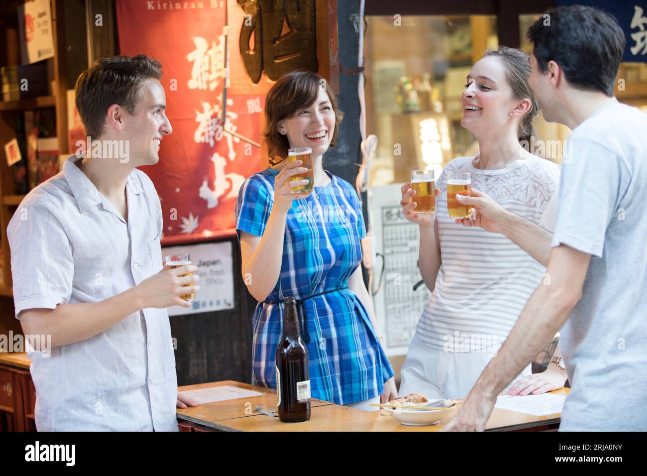 Four foreign men women hi-res stock photography and images - Alamy