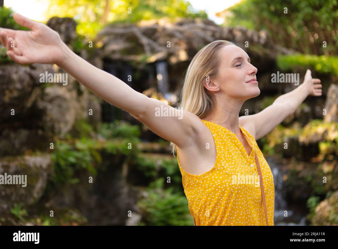 Woman spreading arms hi-res stock photography and images - Alamy