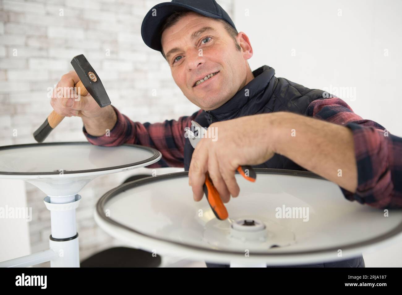handyman repairing chair in apartment Stock Photo - Alamy