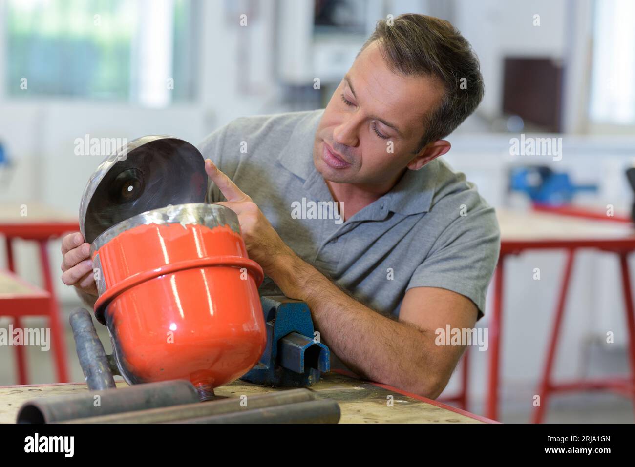 Man fixing water pump hi-res stock photography and images - Alamy