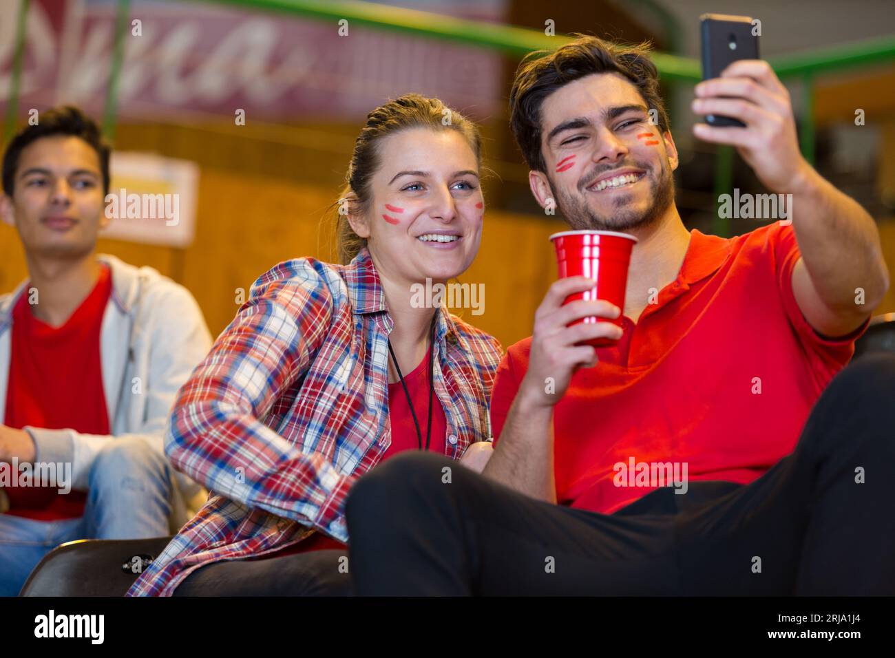 club fans taking selfie Stock Photo - Alamy