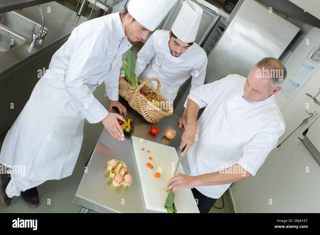Professional chef trainee cooking hi-res stock photography and images ...
