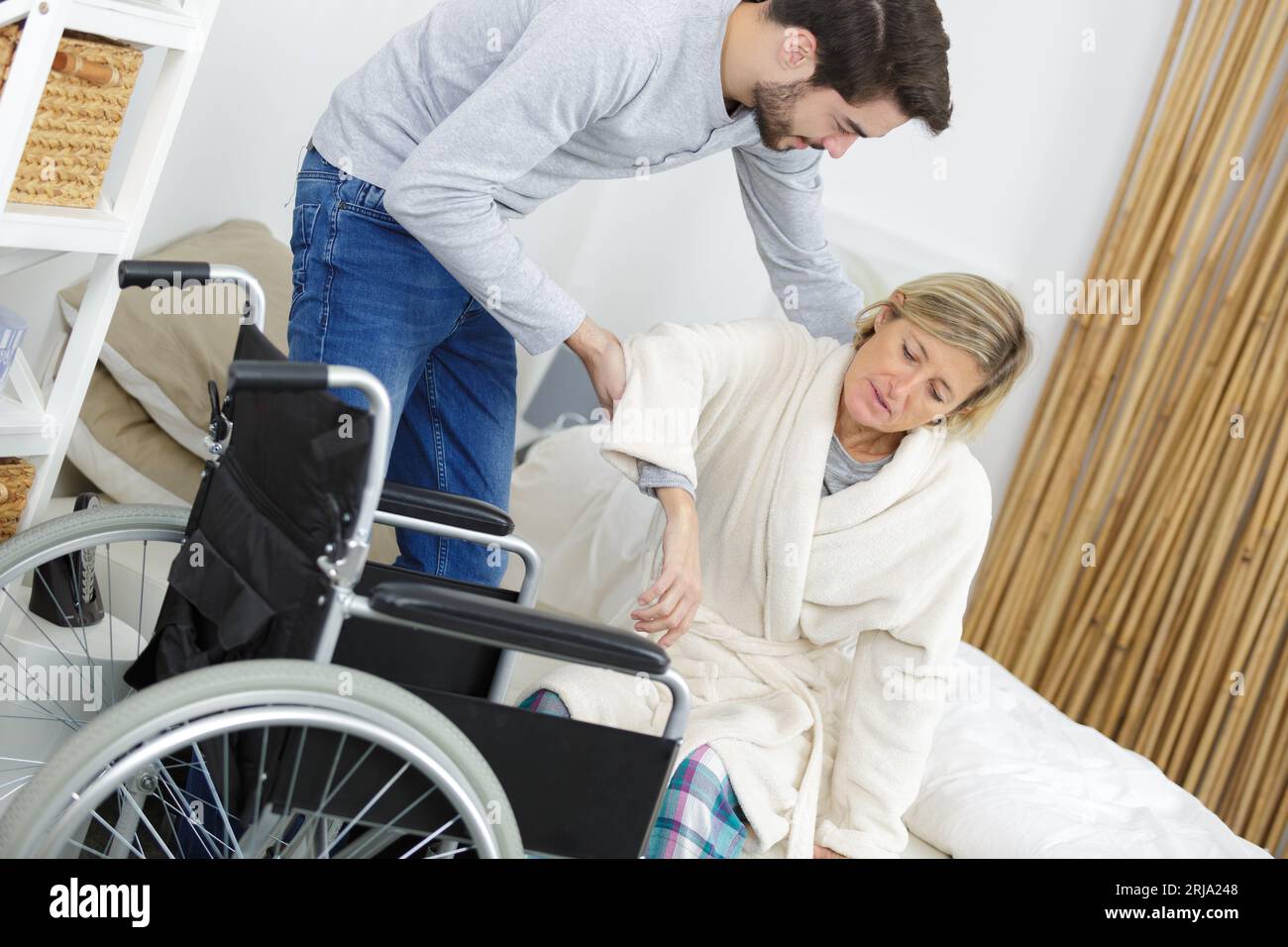 Older woman getting out bed hi-res stock photography and images - Alamy