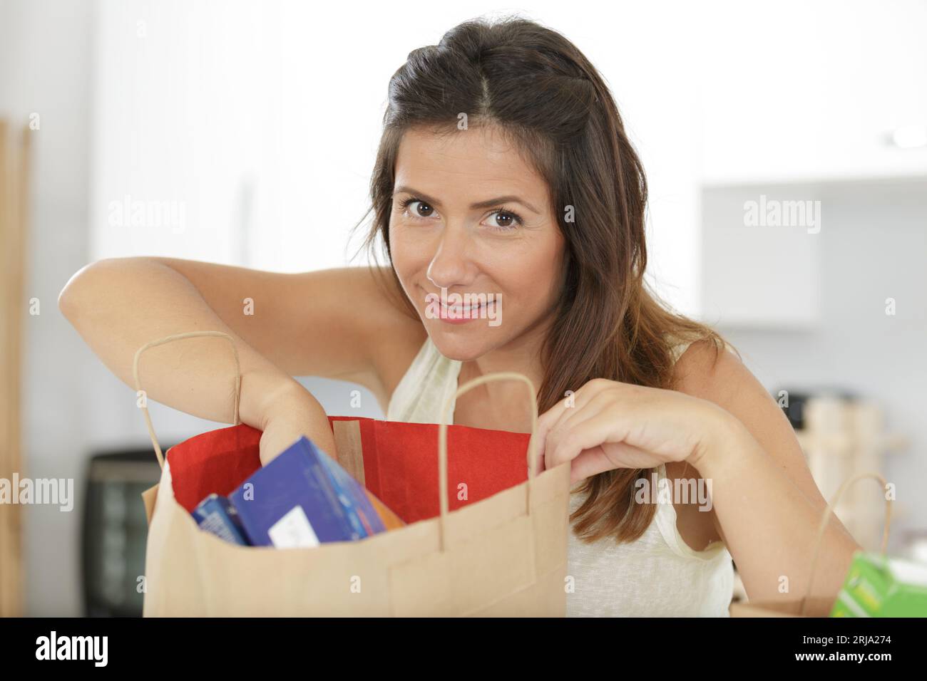 Woman unpack food hi-res stock photography and images - Alamy