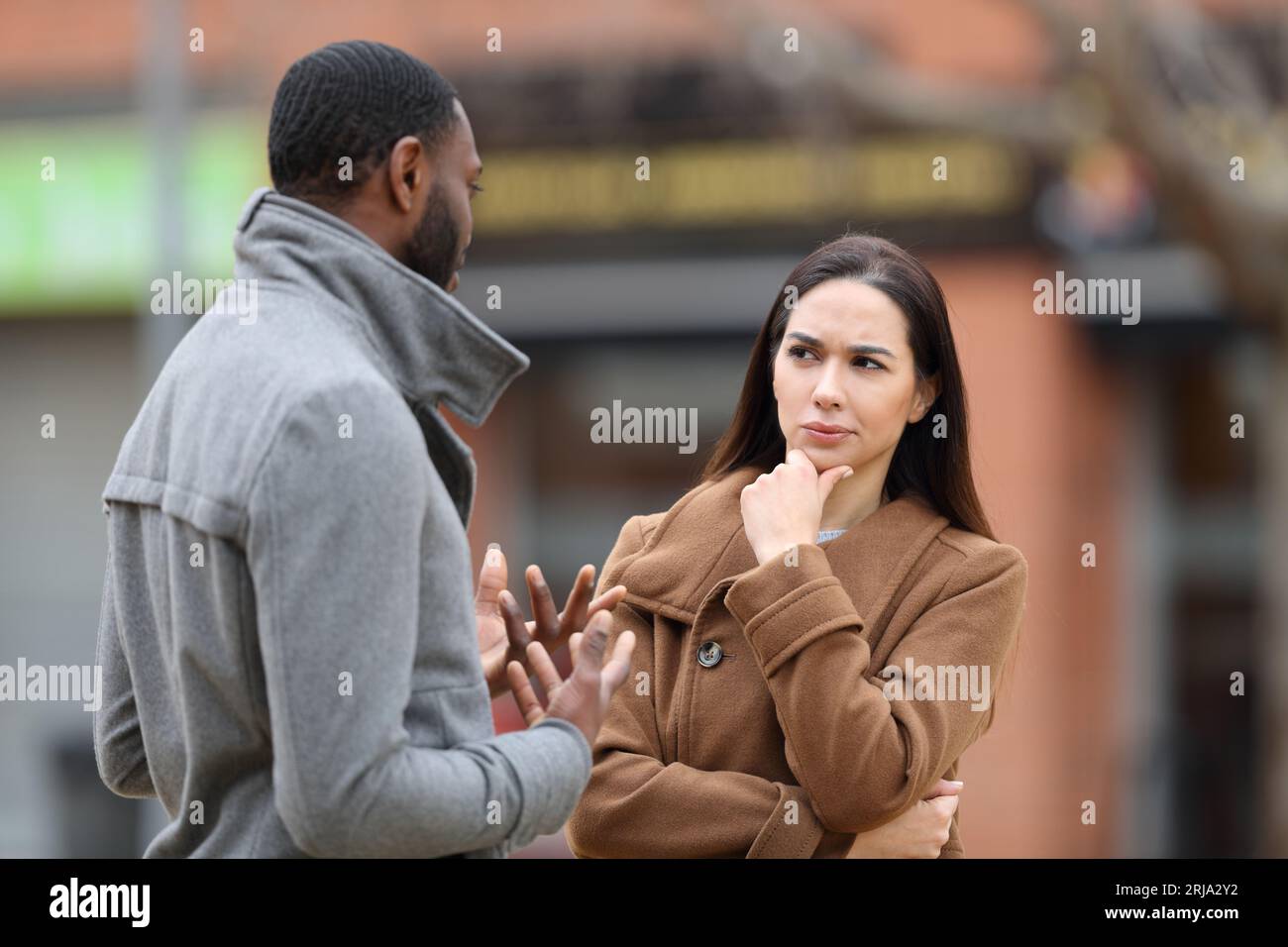 Two people facing each other talking hi-res stock photography and ...