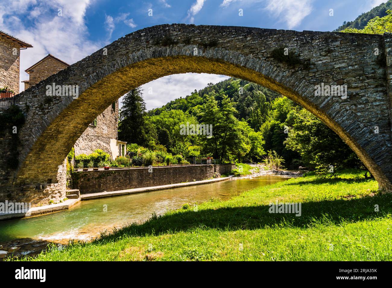 The medieval arch of the Ponte della Maesta bridge in Portico di ...