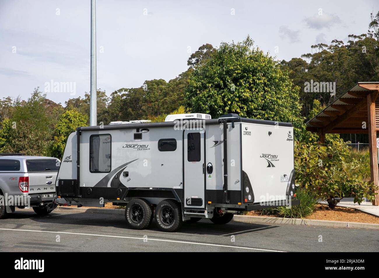 Jayco Outback camper vehicle being toured by a car, on holiday in ...