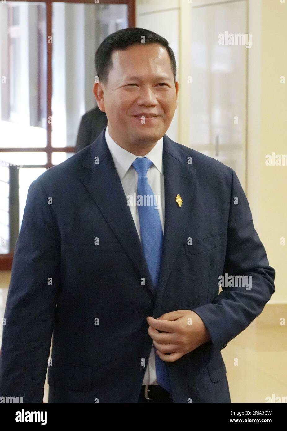 Hun Manet, the eldest son of Cambodian Prime Minister Hun Sen, walks to ...