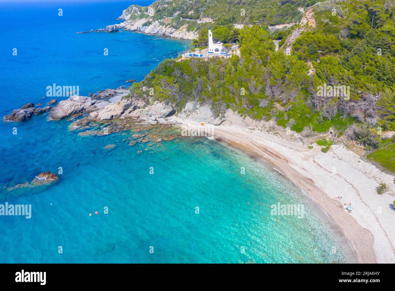 White church in Potami beach with azure sea water, Samos island, Greece ...